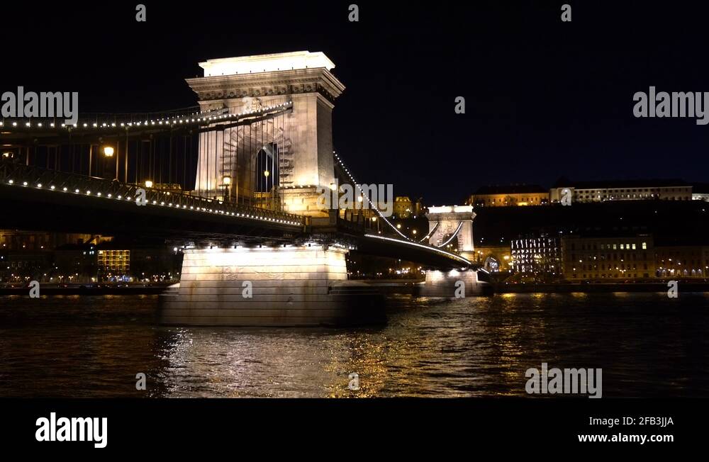 Gentle ripple waves on the Danube river at the Chain Bridge with Castle ...