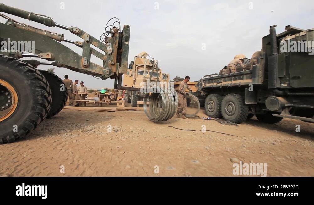 Marines load and unload concertina wires from forklift trucks - 2011 ...