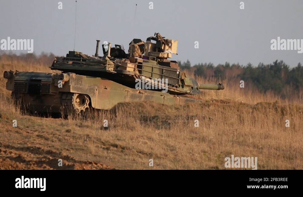 Abrams battle tank firing cannon Stock Video Footage - Alamy