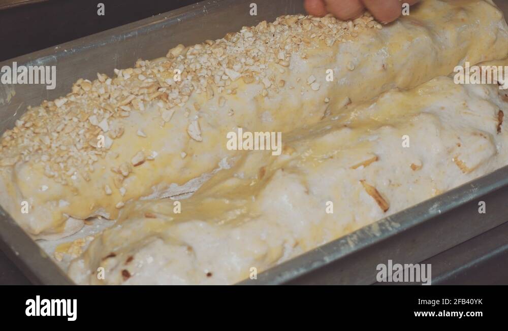 Woman Chef Baking Apple Strudel. Female Hands Sprinkle Chopped Nuts on ...