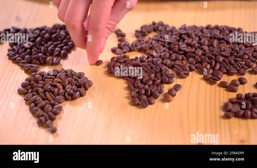 World map of coffee beans. Hand make world map with roasted coffee ...