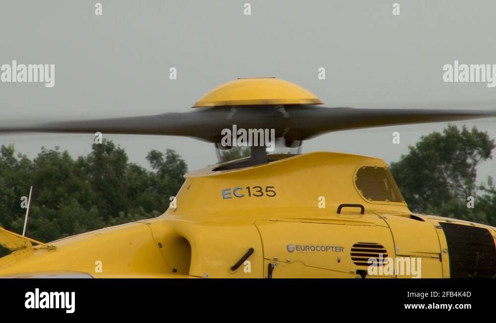 Eurocopter EC135 medical helicopter with rotating main rotor blades ...