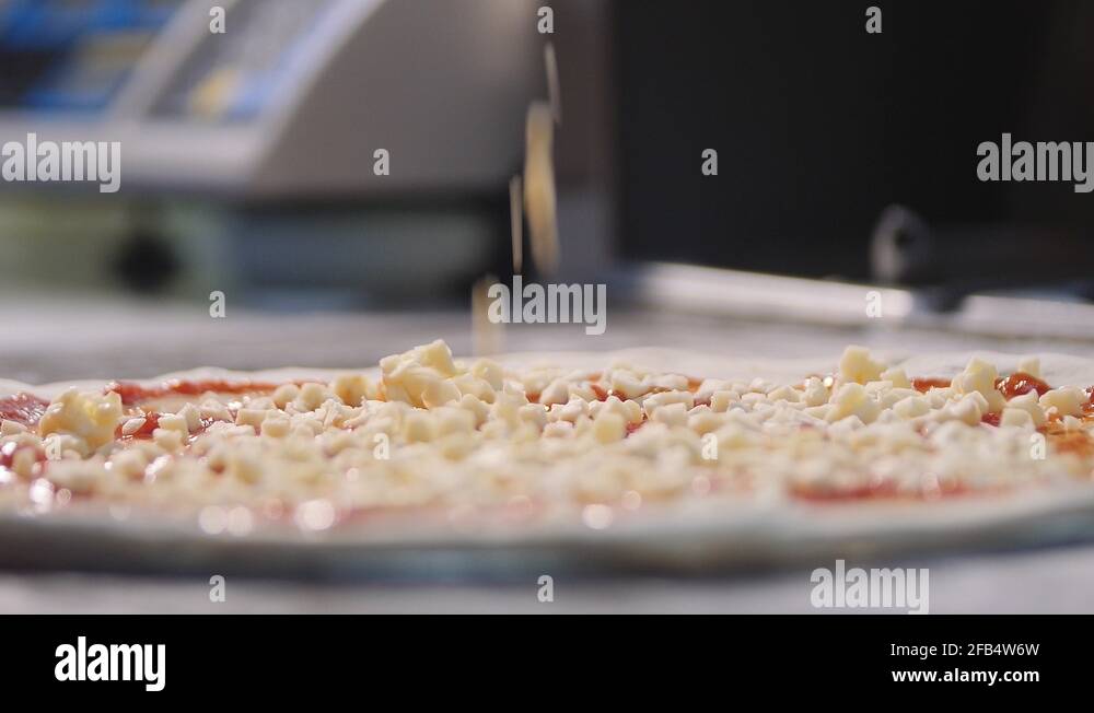 Cooking of pizza. Close-up hands sprinkle cheese pizza. 4k Stock Video ...