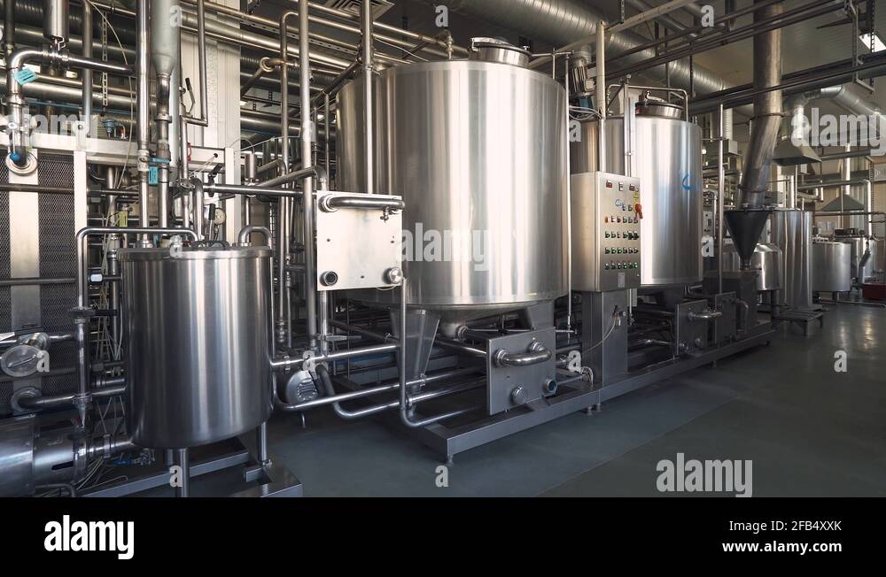 equipment for mixing and production of ice cream, view of steel tanks ...