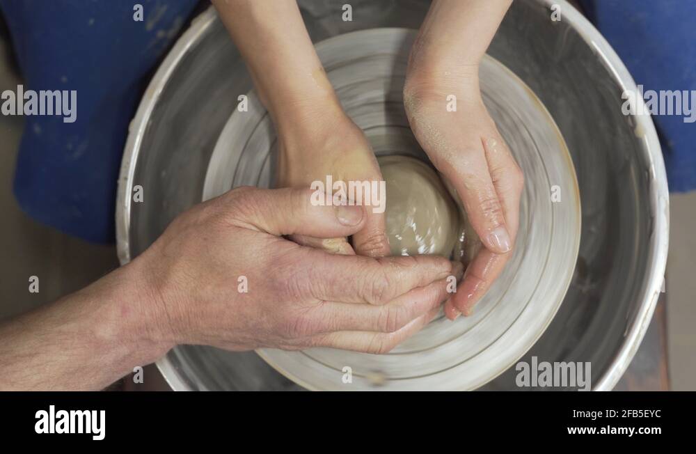 A close up video of pottery making process. A skilful female master ...