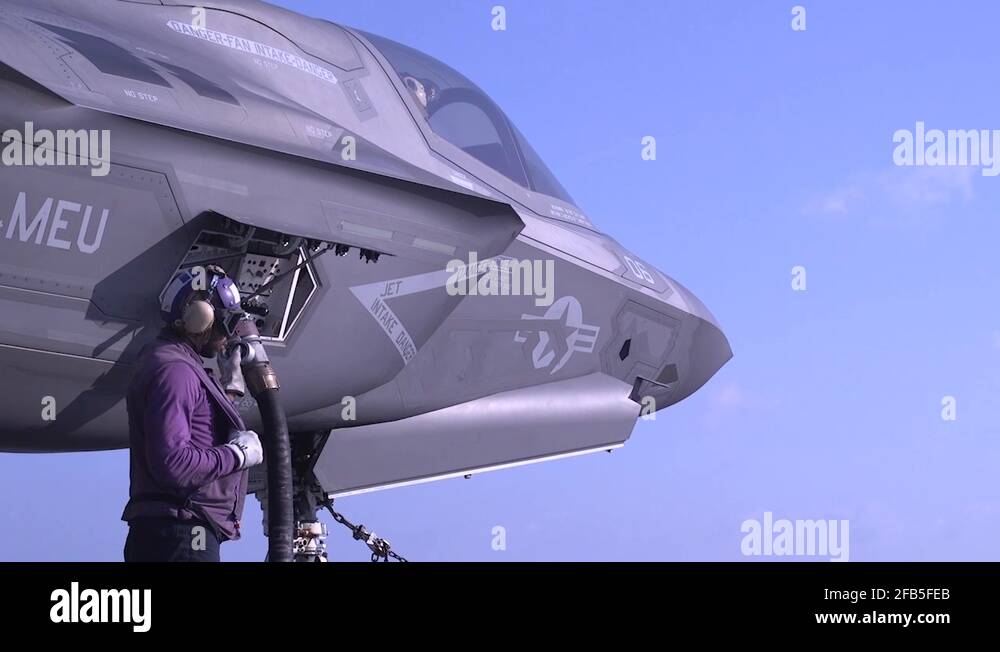 Aviation fuel handler grape refueling F-35B Lightning II aboard USS ...