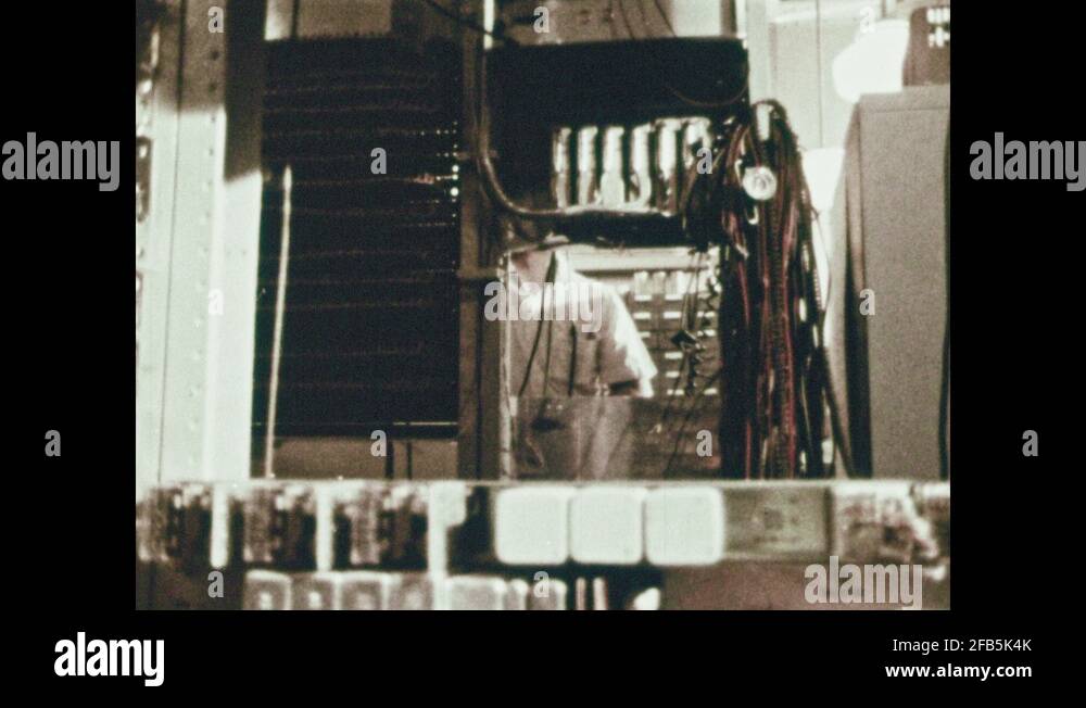 1960s: MEXICO: Man works at computer. Man works at switchboard Stock ...