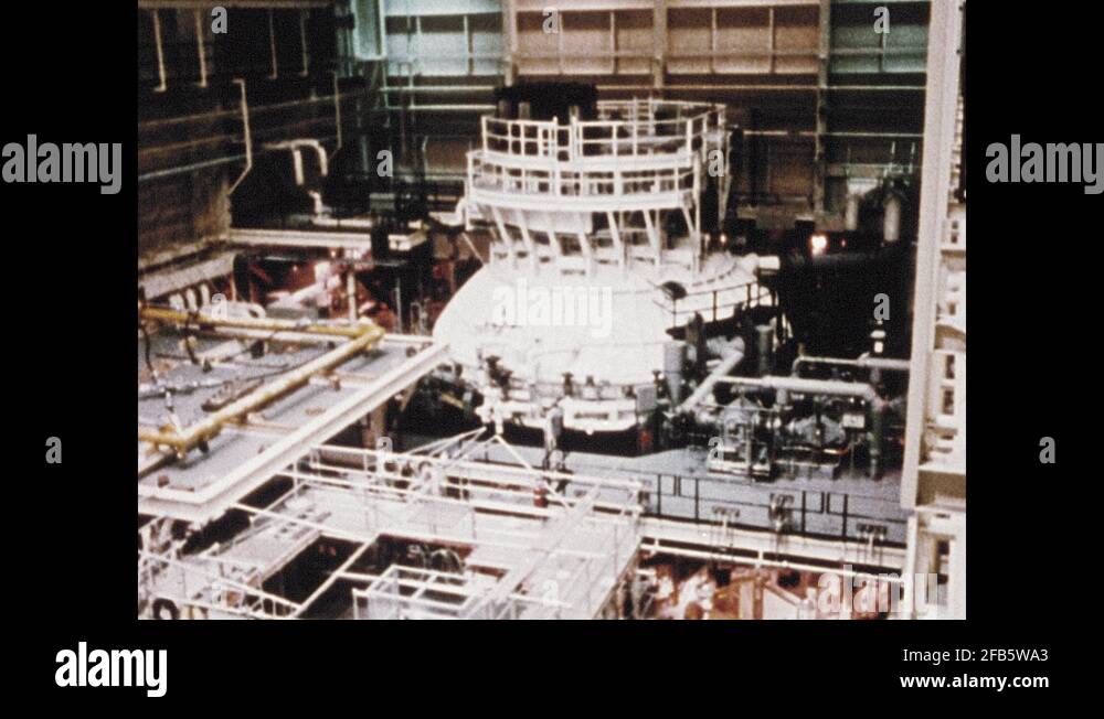 1960s: Interior of NASA facility. View through window, astronaut in ...