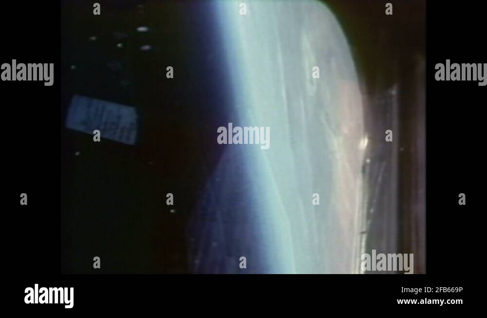1980s: Looking out window of space shuttle at earth as shuttle ...