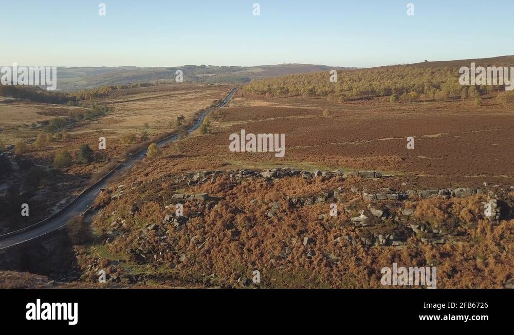 Drone view of hills and highway in Peak District National Park ...