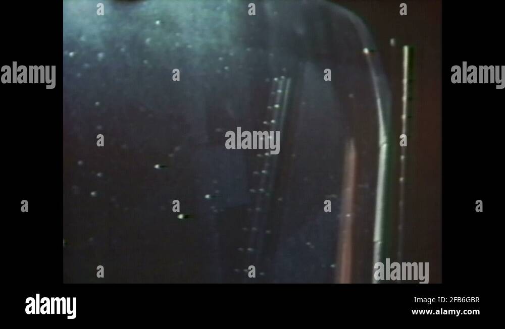 1980s: Looking out window of space shuttle as it rockets into space ...