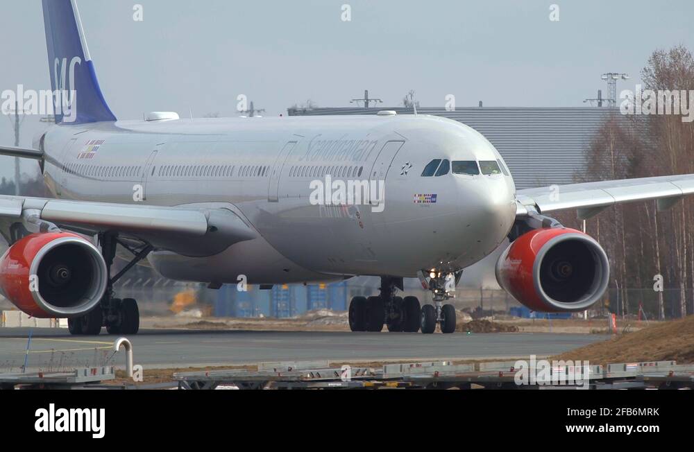 airplane scandinavian airlines airbus 330 turning front view taxiway ...