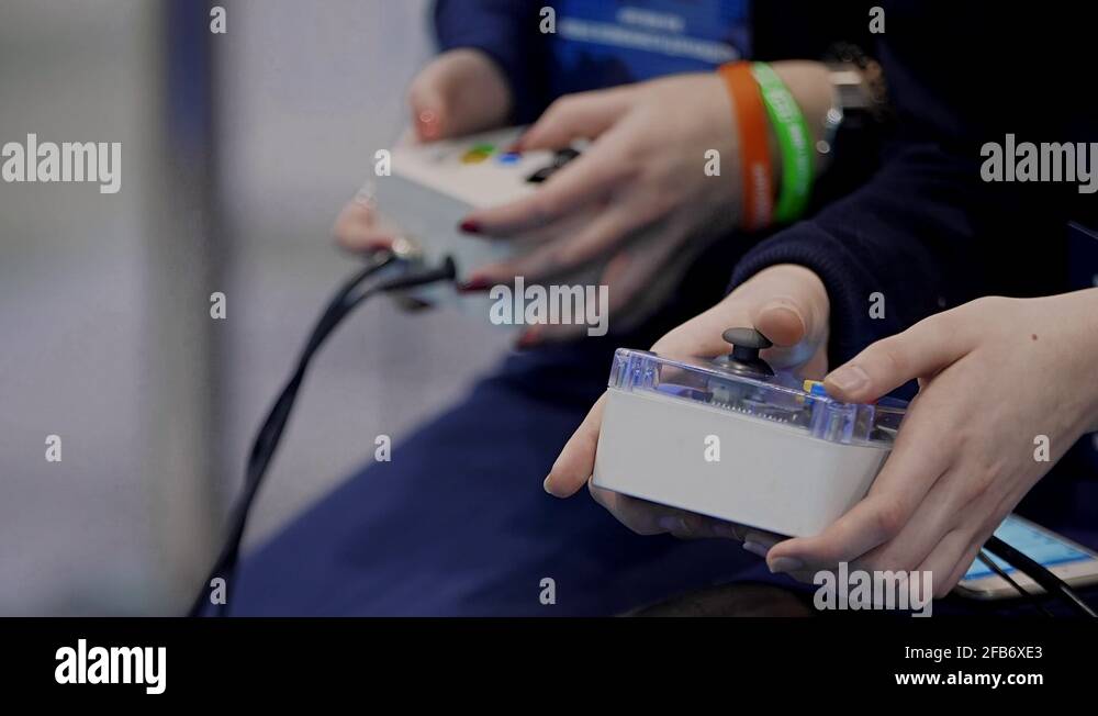 Boy hands holding remote controlling robot Stock Video Footage - Alamy