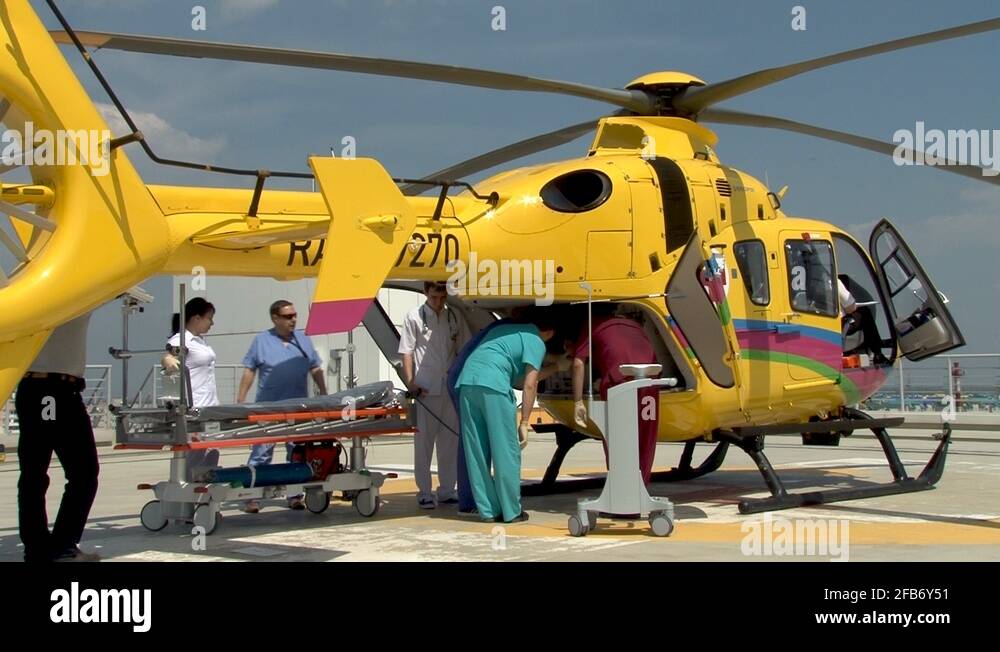 Medical Eurocopter EC135 on helipad on roof of hospital Stock Video ...