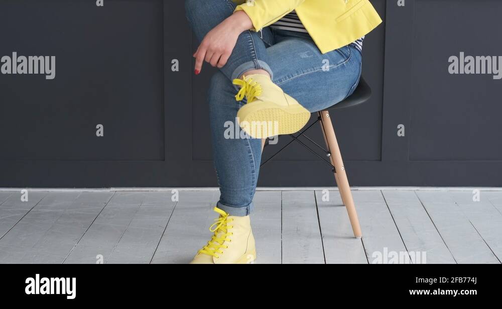 Woman sitting on stool legs crossed Stock Videos & Footage - HD and 4K ...