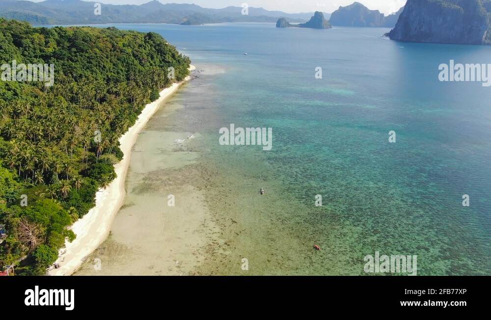 Unspoiled beach with jungle and reef visible Stock Video Footage - Alamy