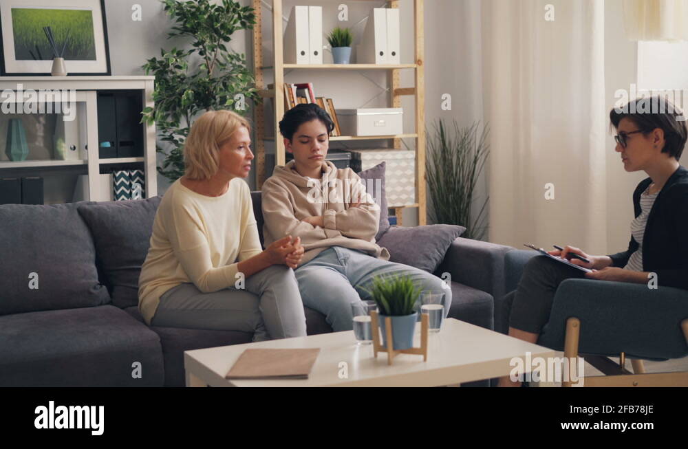 Concerned mother talking to psychologist about relationship with ...