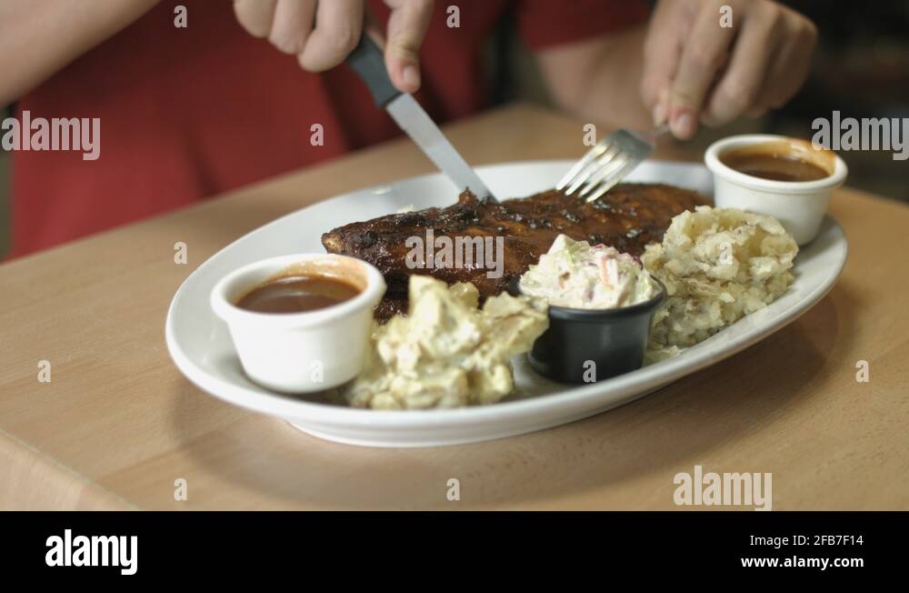 Man eating pork ribs Stock Videos & Footage - HD and 4K Video Clips - Alamy