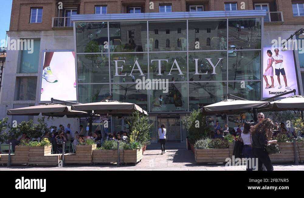 Eataly front entrance view people are coming and going in and out from ...