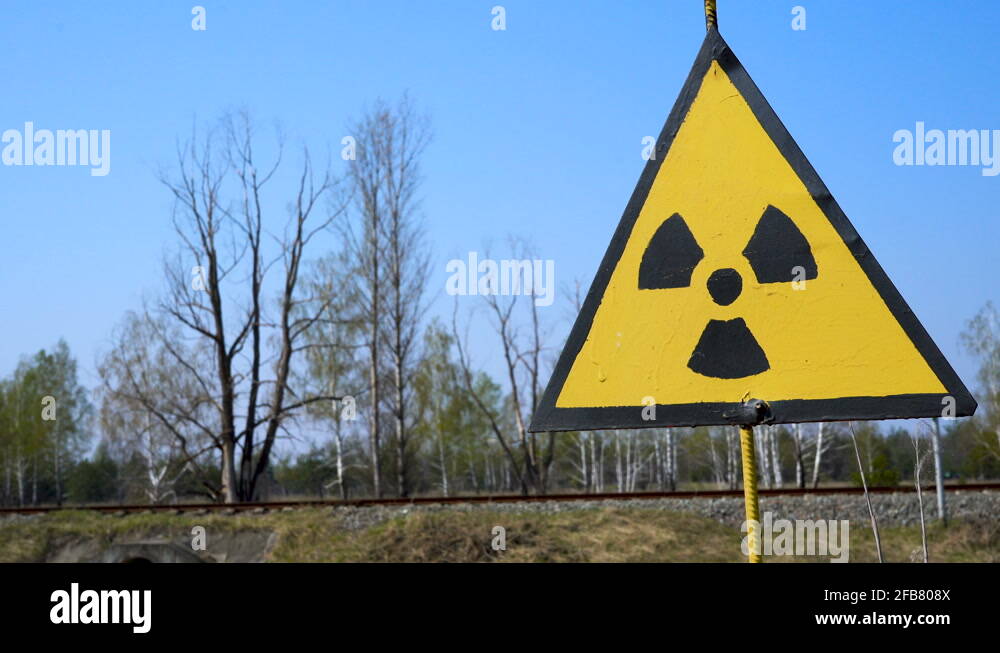 Black sign of radiation on a yellow background. Chernobyl Exclusion ...