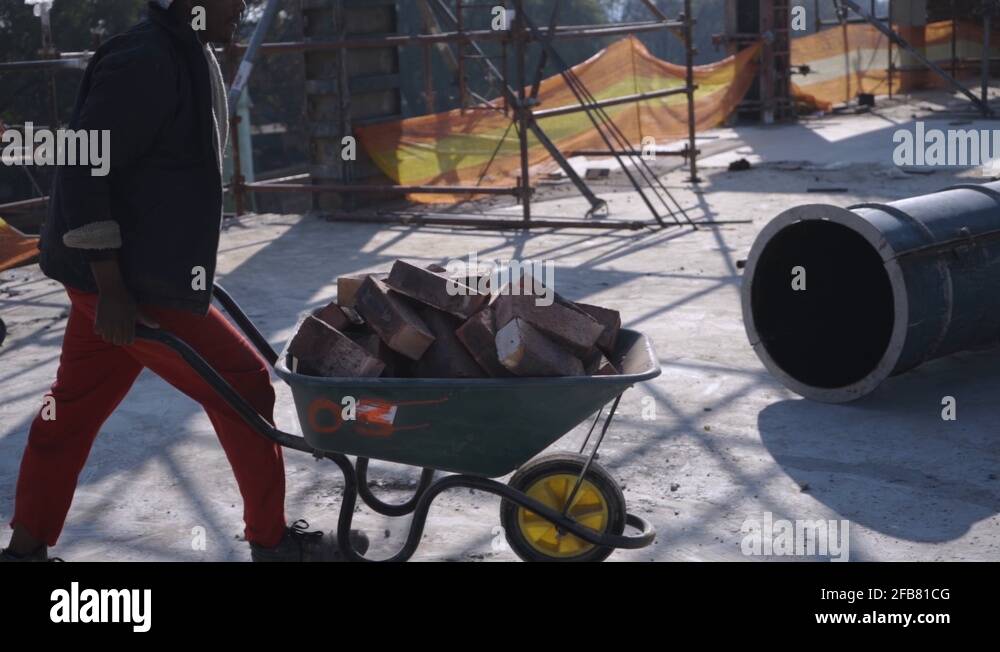 Pushing wheelbarrow builder Stock Videos & Footage - HD and 4K Video ...