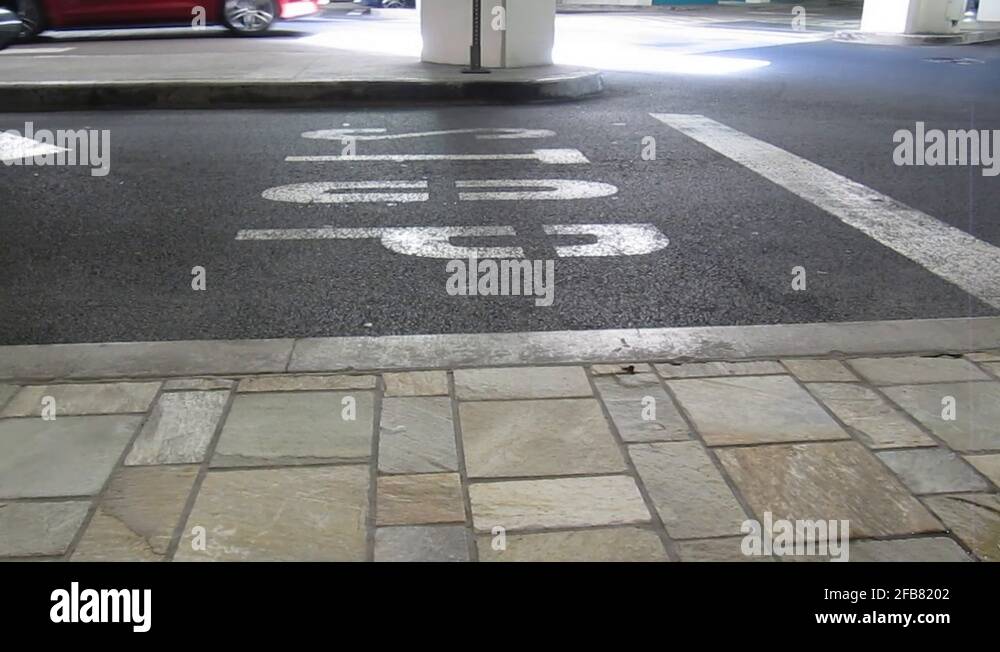 Stop sign and street market with car traffic flow at shopping mall ...