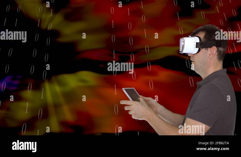 man uses tablet and VR glasses. Standing in front of animated ...