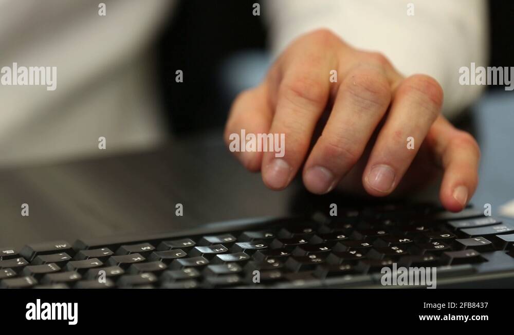Typing man struggles with painful repetitive strain injury (RSI, Carpal ...