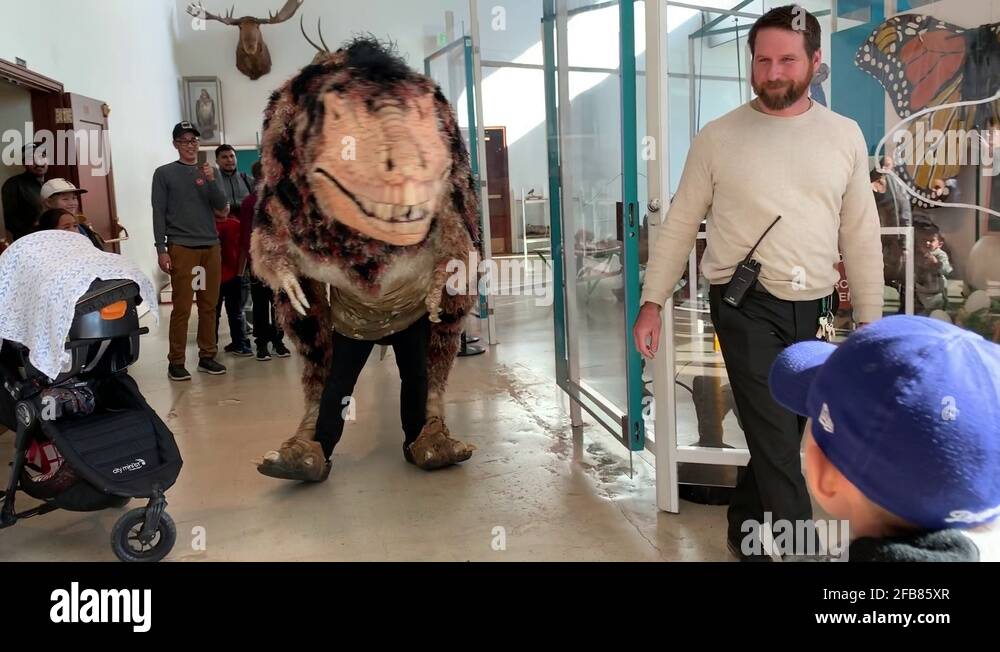 A large scaled T-Rex puppet roaring at children inside the Discovery ...