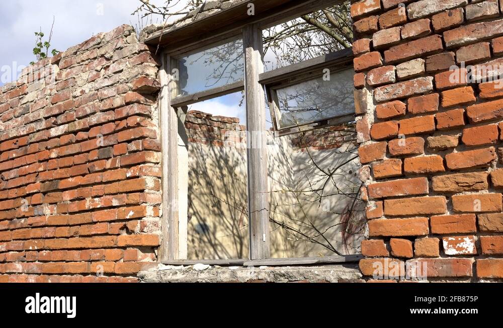 Wall of a red brick old house and it’s broken wooden window, Broken ...