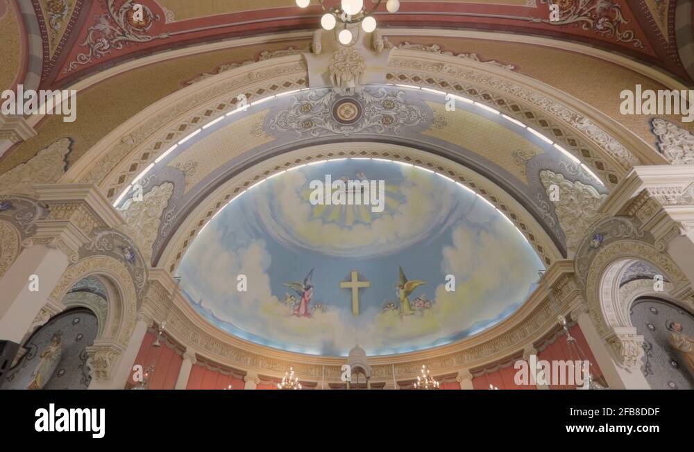 Slow tilt down revealing the entire altar in Maristas Catholic Church ...