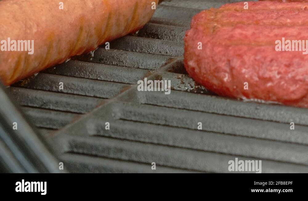 Food Cooking on Grill with Flare Ups TILT UP PAN RIGHT SLOW MOTION ...