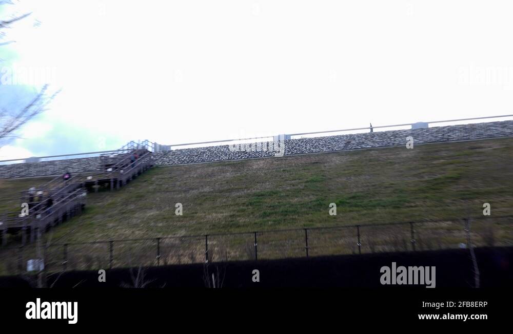 A man walks on the top of a slope. Daytime. Front-side. Background ...