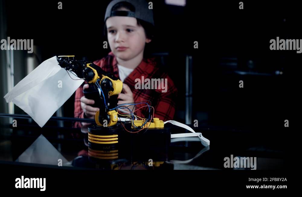 4k Child Boy Controlling the Robotic Arm with Tissue Stock Video ...