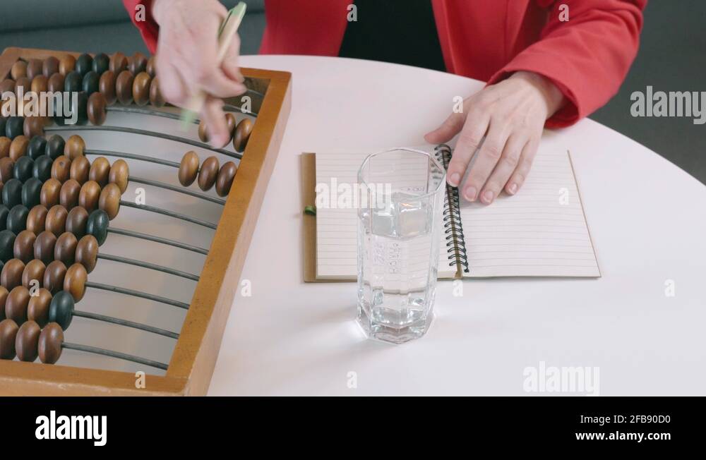 An accountant working on desk office with using an ancient abacus Stock ...