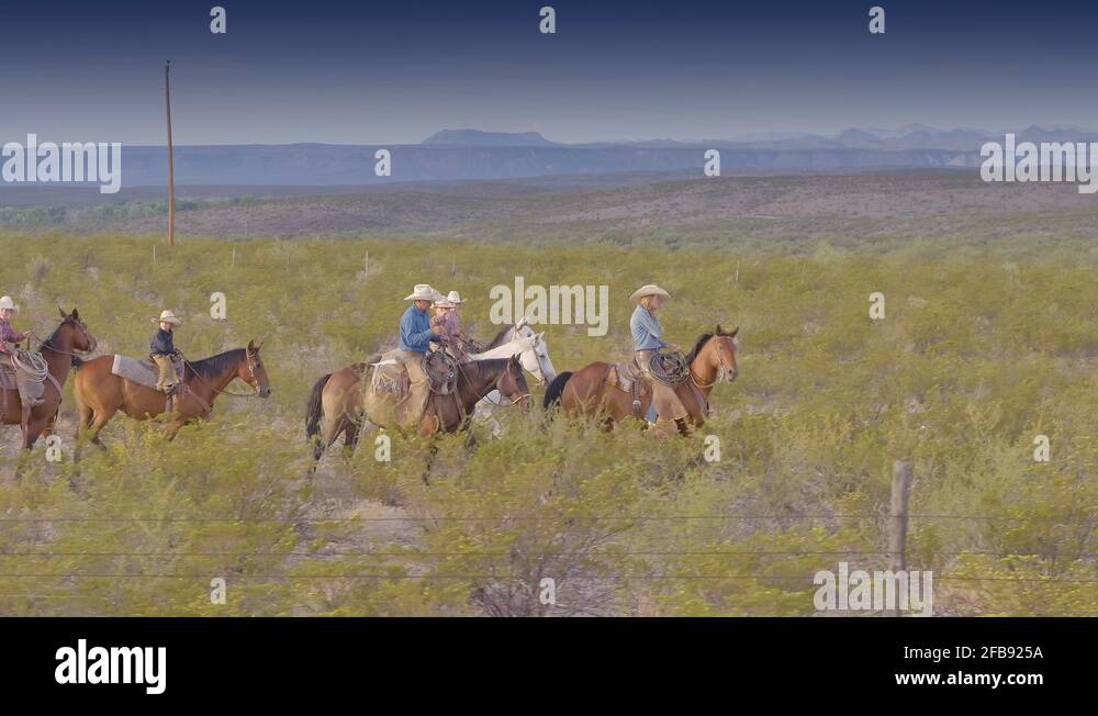 Rancher Family Riding In Frame, Old Western Landscape In Distance 4k ...