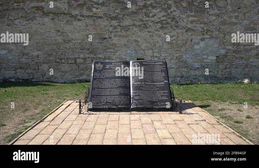 Black marble book like commemorative monument written in Cyrillic ...