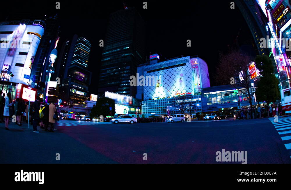 Night time lapse crossing at the neon town in Shibuya Tokyo wide shot ...