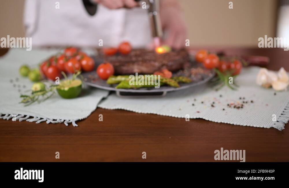 Woman cooking steak Stock Videos & Footage - HD and 4K Video Clips - Alamy