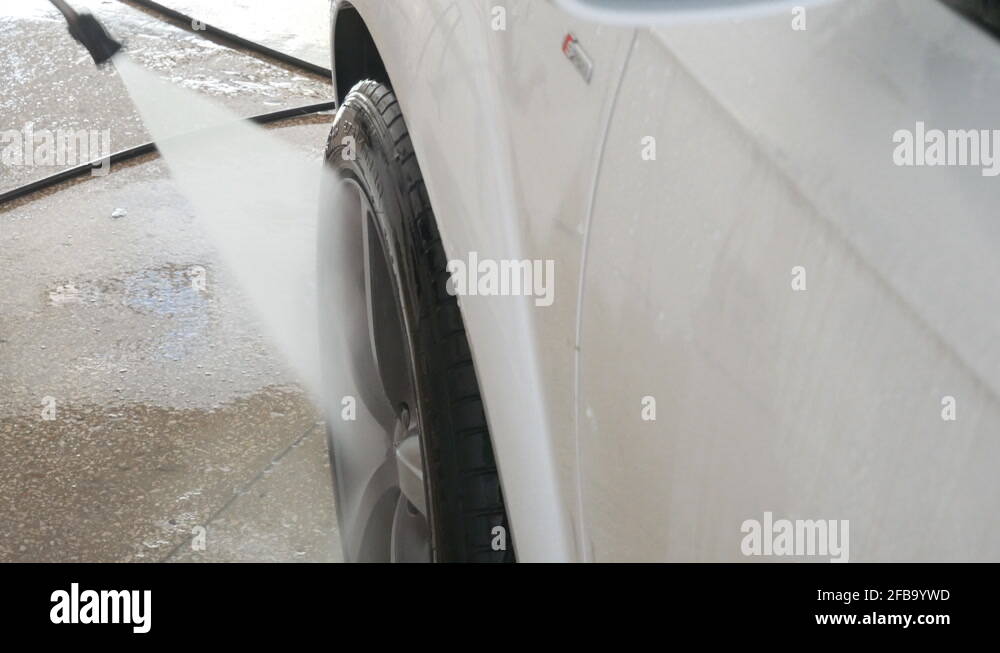 car wash with high pressure water. Concept: Car service, car wash ...