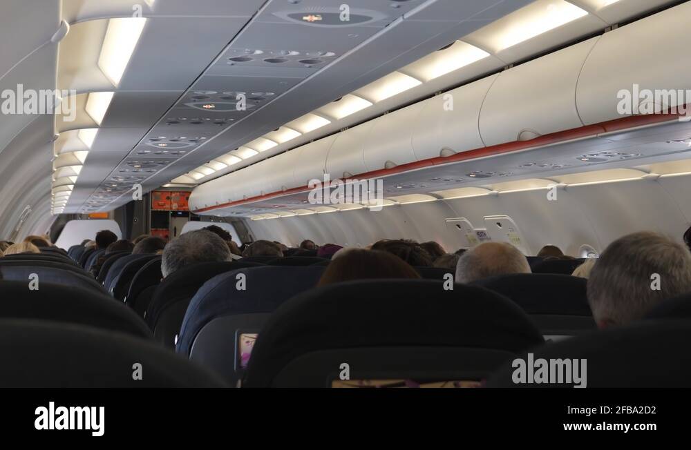 People sitting inside aircraft in flight Stock Video Footage - Alamy