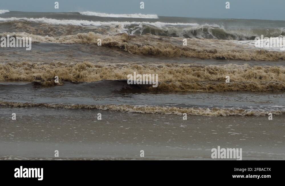Very polluted beach and water in the ocean full of trash beach Stock ...