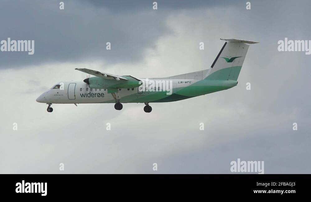 propeller commuter passenger airplane wideroe rear view dramatic ...