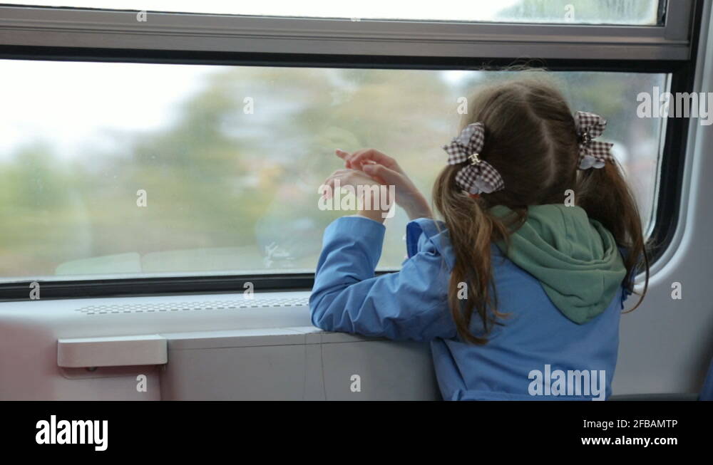 Little girl in moving train Stock Video Footage - Alamy