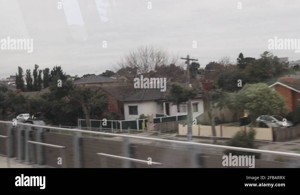 A train trip looking out the window of the Melbourne metro train system ...