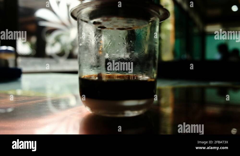 Traditional Vietnamese drip coffee method Stock Video Footage - Alamy