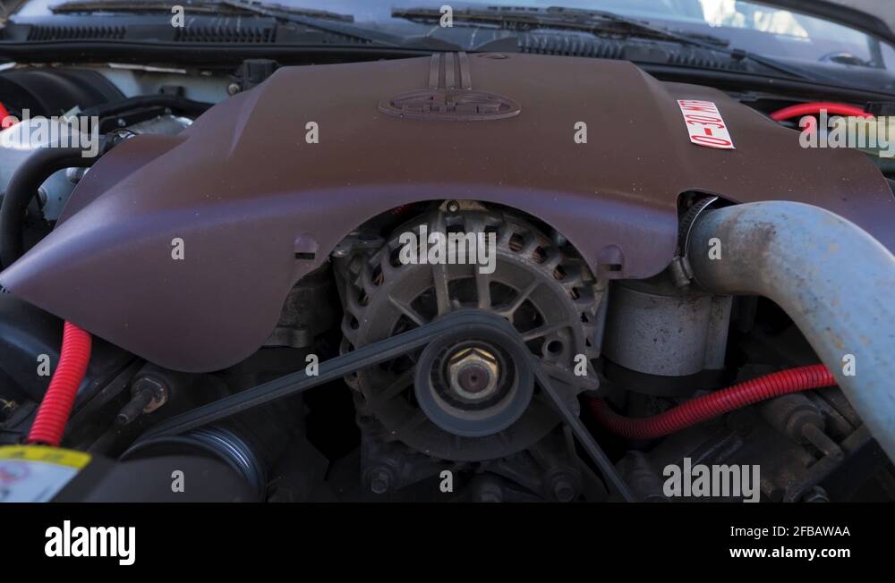 Zoom out from open car hood mechanical car engine Stock Video Footage ...