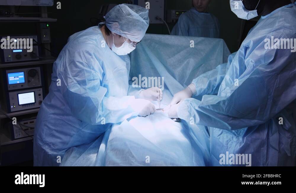 Female surgeon finishing operation Stock Video Footage - Alamy