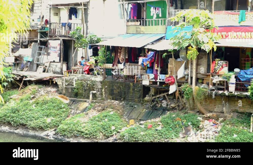 Slum and poor houses on the riverside Stock Video Footage - Alamy