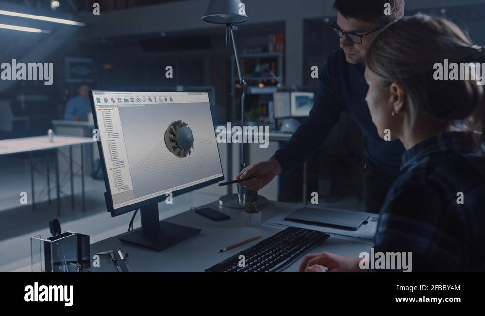 Engineer Working on Desktop Computer, Screen Showing CAD Software with 3D Engine Stock Video ...